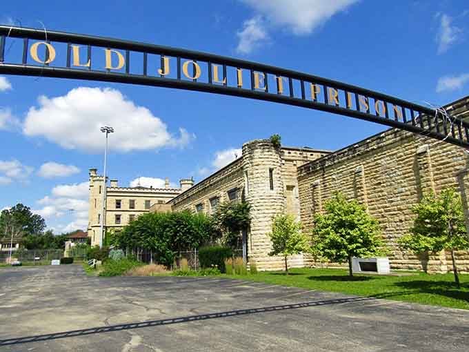 The "Old Joliet Prison" entrance arch welcomes tourists now, though its original guests arrived under very different circumstances and attitudes.