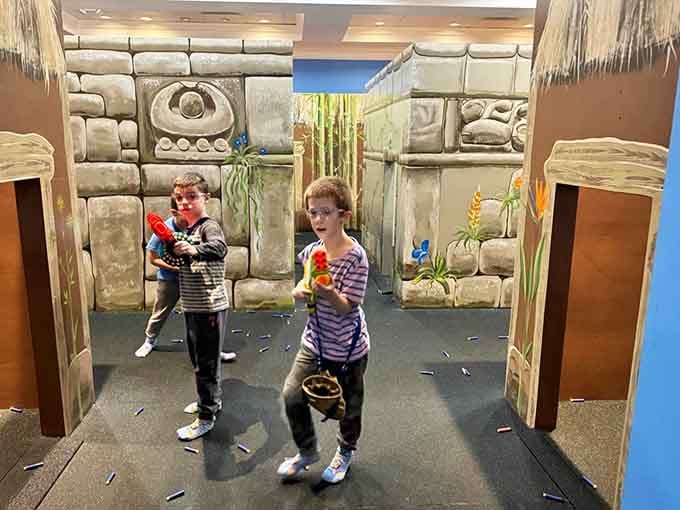 Two young competitors stand ready in the temple zone, their expressions suggesting they're taking this foam warfare very, very seriously indeed.