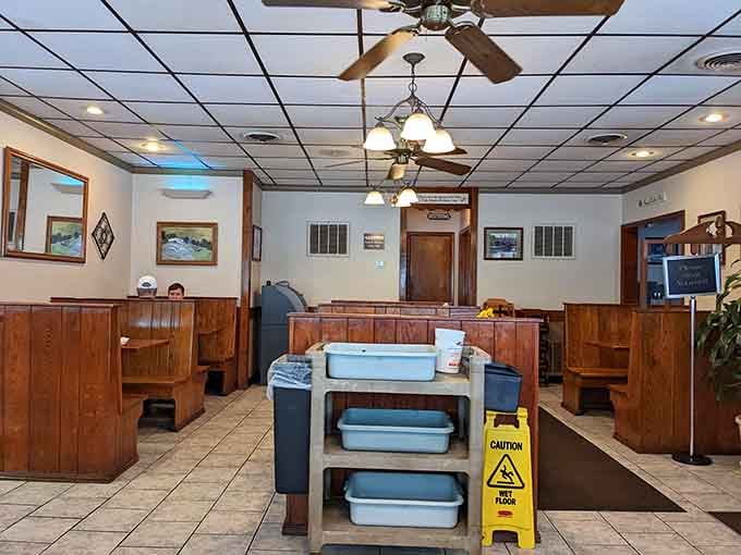 Wooden booths and ceiling fans create that timeless diner atmosphere where everyone feels welcome and nobody feels rushed.
