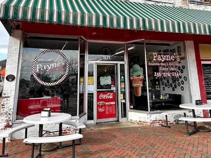 Outdoor seating on brick pavers under that green awning&mdash;perfect for people-watching while sandwich-eating in downtown Scottsboro.