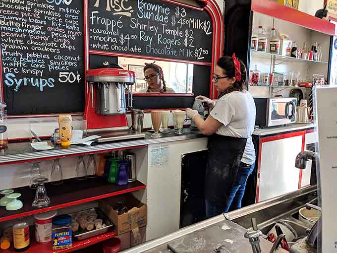 Behind the scenes, the magic happens one scoop, shake, and sandwich at a time with practiced precision and care.