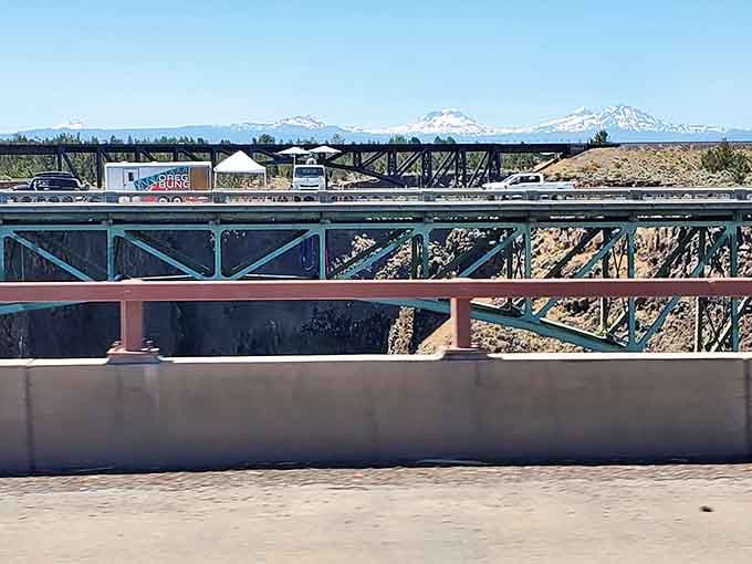 All three bridges visible in one frame: the old, the new, and the railroad classic.