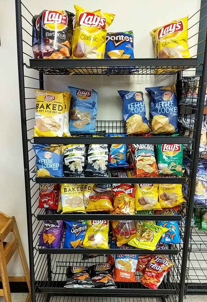 That glorious chip rack displaying every flavor from classic to kettle-cooked, organized like a salty, crunchy library of snacking.