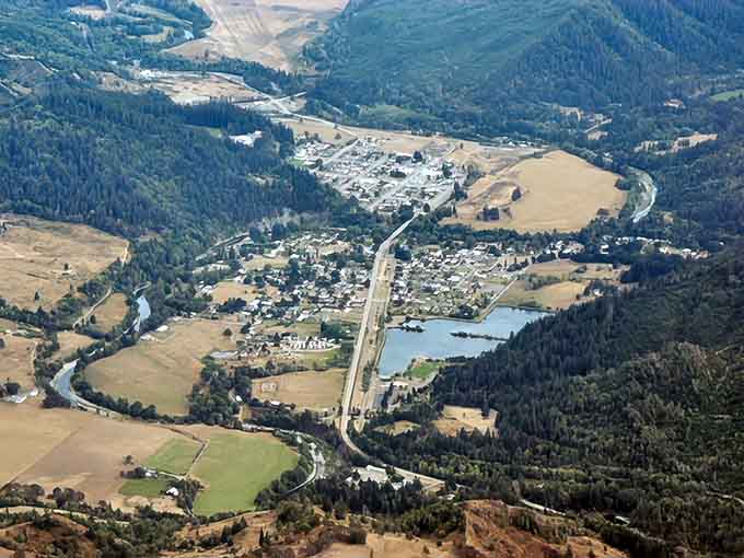 From above, Powers reveals itself as a tiny human settlement courageously carved into an endless sea of green forest.