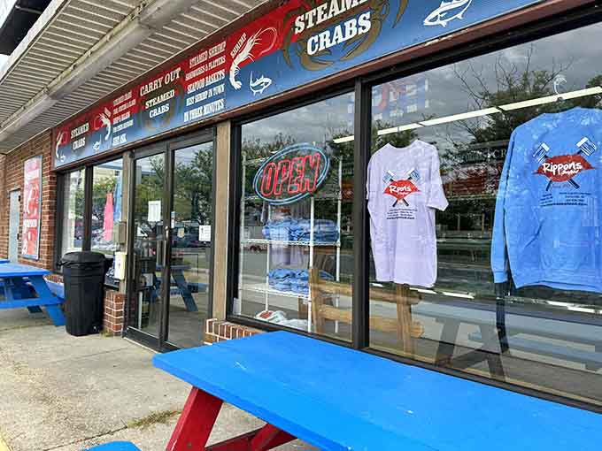 That glowing neon "OPEN" sign and colorful picnic tables outside promise casual dining at its absolute finest and most welcoming.