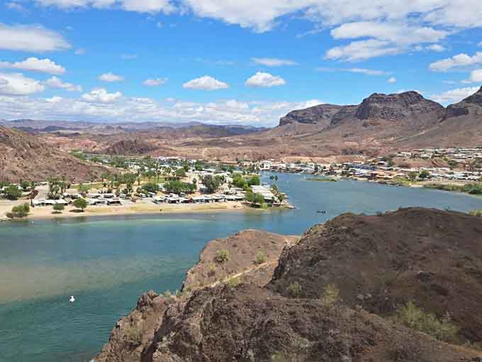 From above, the river curves through desert like a blue ribbon someone dropped on brown wrapping paper.