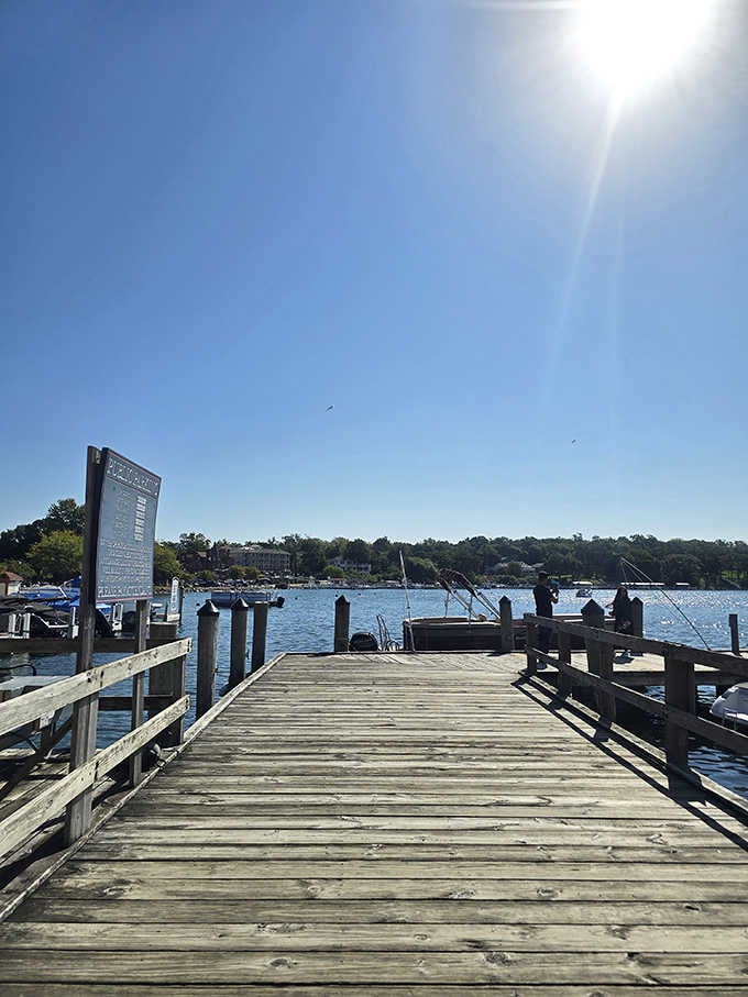 The fishing pier stretches into crystal waters, offering anglers and daydreamers equal opportunity for contemplation.