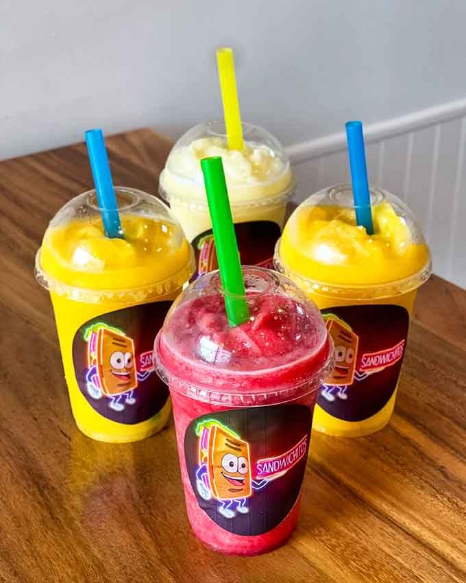 Sandwichitos' fruit shakes arrive in colors so vibrant they look like liquid sunshine captured in convenient cups.