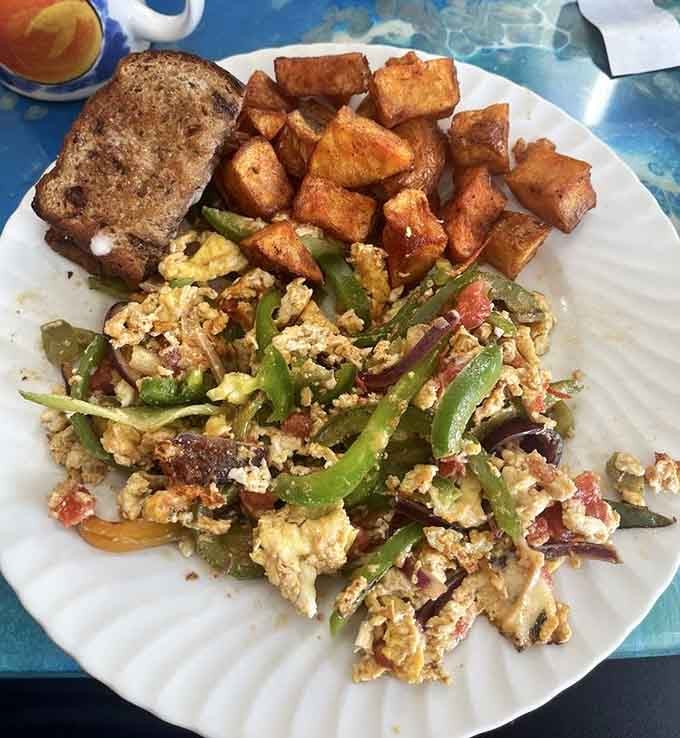 The Southwest scramble brings peppers, onions, and perfectly cooked eggs together like a Tex-Mex breakfast reunion you didn't know you needed.