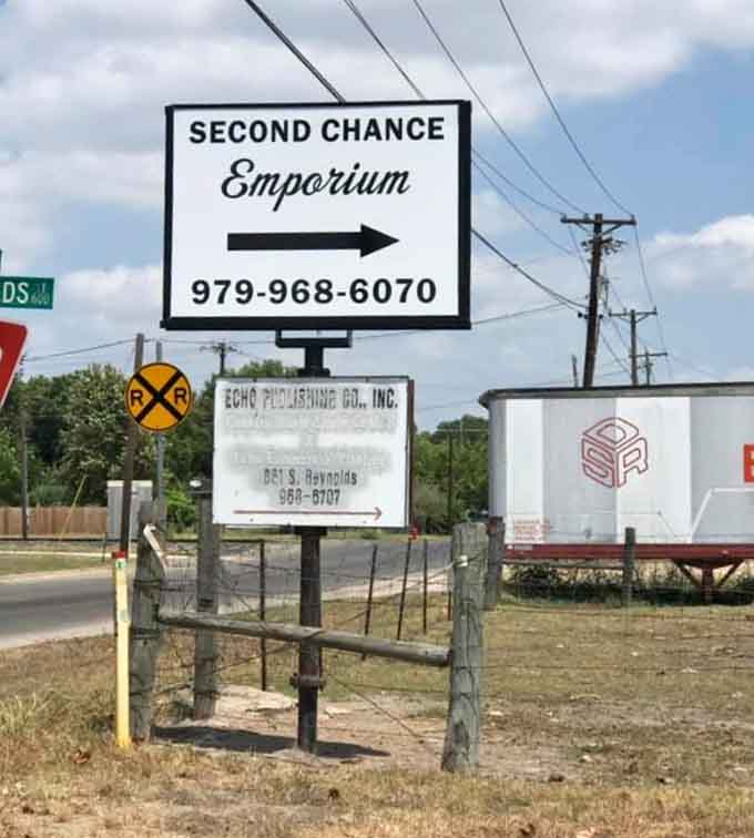 The simple sign points the way to savings, like a beacon of hope for bargain hunters everywhere.