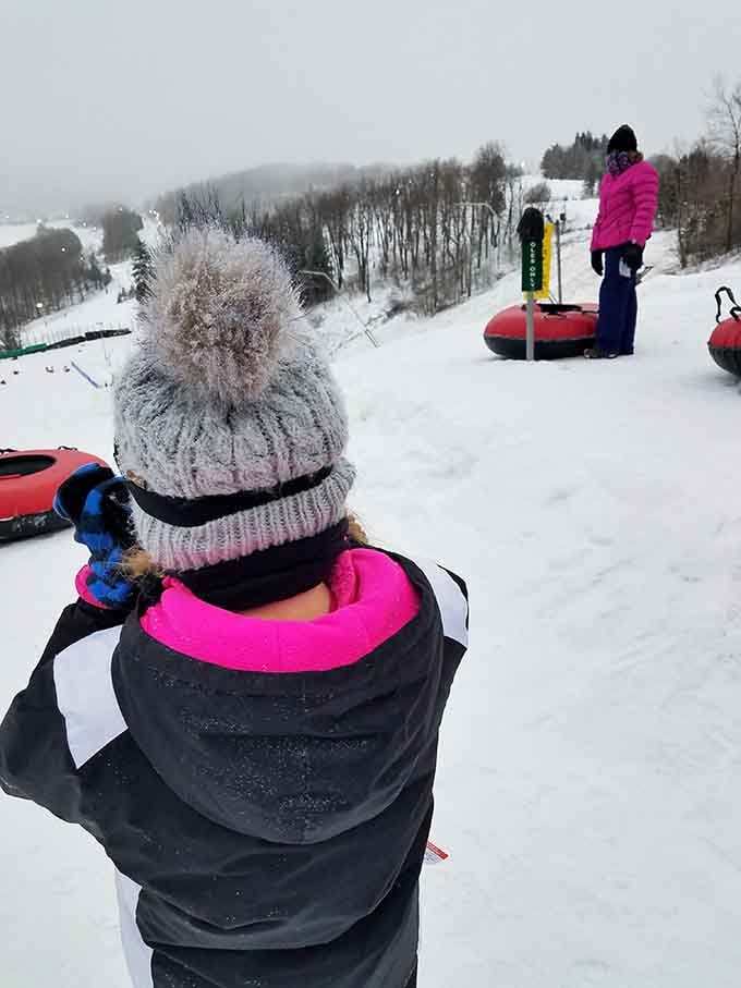 Getting ready to tube down a snowy mountain: where anticipation meets that little voice saying "what am I doing?"