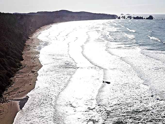 Two miles of pristine coastline stretching before you, proof that some things are worth the four-mile hike.