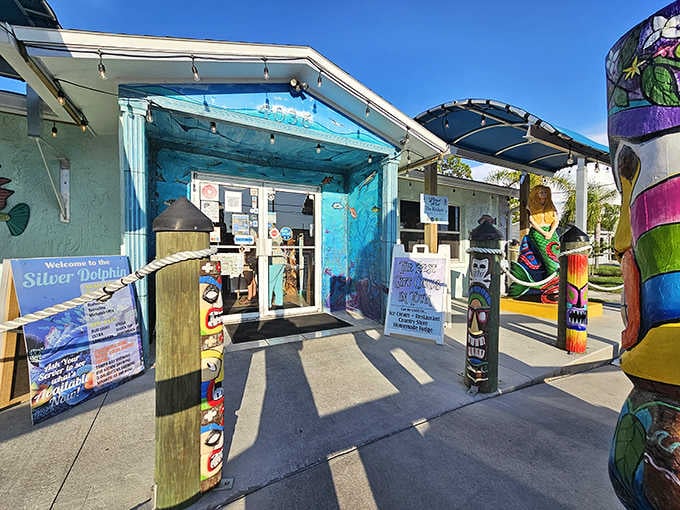 The entrance welcomes you with painted posts and beach vibes that promise good food and zero pretension inside.
