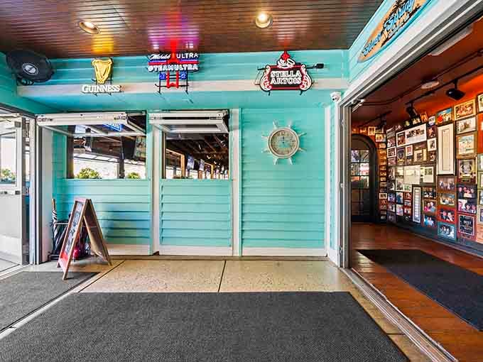 That turquoise entryway with garage doors open to the world says "come on in, we've been expecting you."