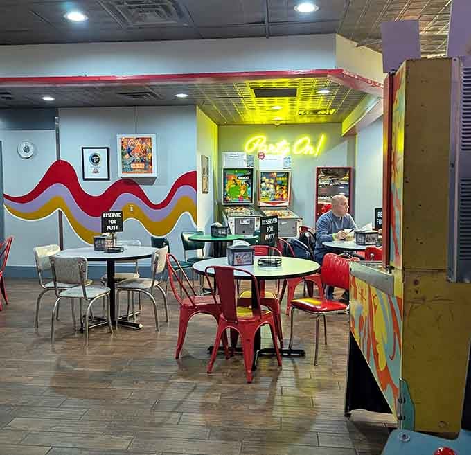 The retro dining area channels serious diner vibes where you can refuel between gaming marathons and victory laps.