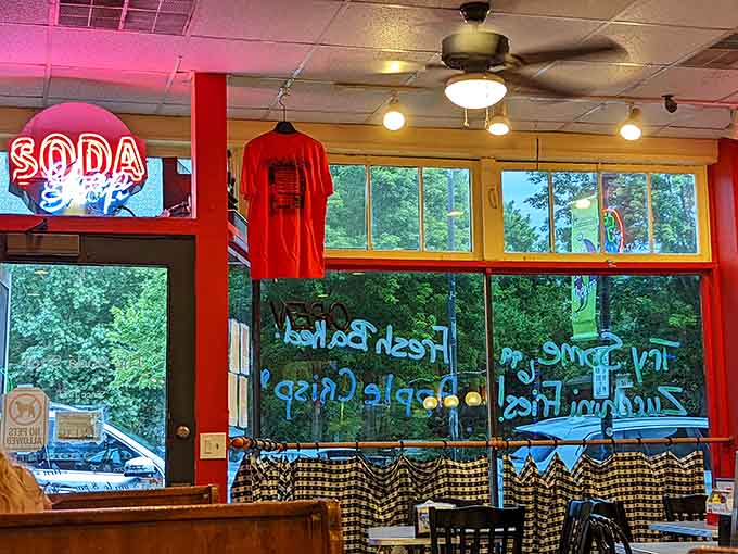 Window lettering and red walls welcome you inside where the food matches the cheerful, inviting vintage atmosphere.