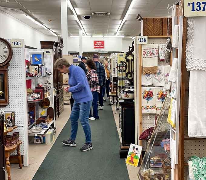 Fellow treasure hunters in their natural habitat, probably debating whether they really need another vintage find.