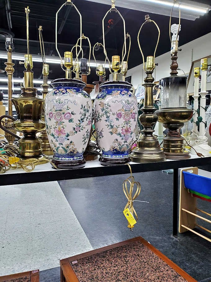 Decorative lamps clustered together like they're gossiping about their former homes, now seeking new mantels to illuminate.