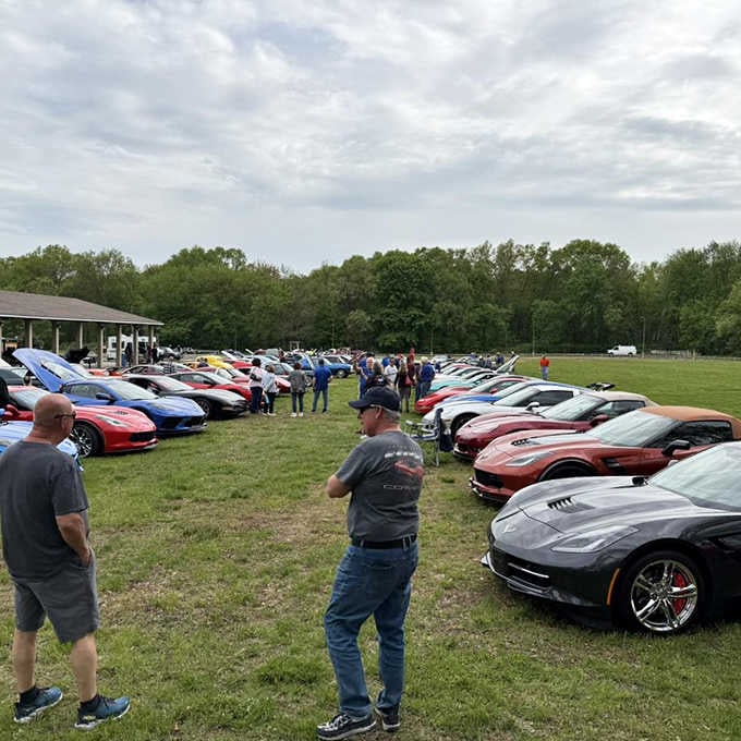 Corvettes line up like a rainbow of fiberglass dreams, turning the drive-in into an impromptu car show spectacular.