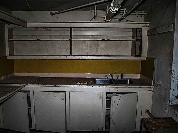 A vintage kitchen setup that looks like it could star in a horror movie about haunted hospital cafeterias.