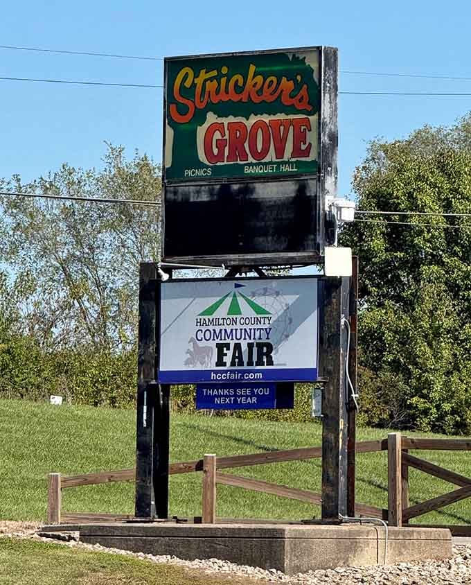 Vintage signage announces Stricker's Grove with weathered charm, a roadside beacon for those seeking authentic amusement park magic.