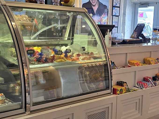 The dessert display case tempts passersby with colorful creations that should probably come with a warning label about willpower.
