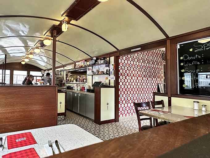The geometric pattern divider adds visual interest while maintaining that authentic vintage diner aesthetic throughout the space perfectly.