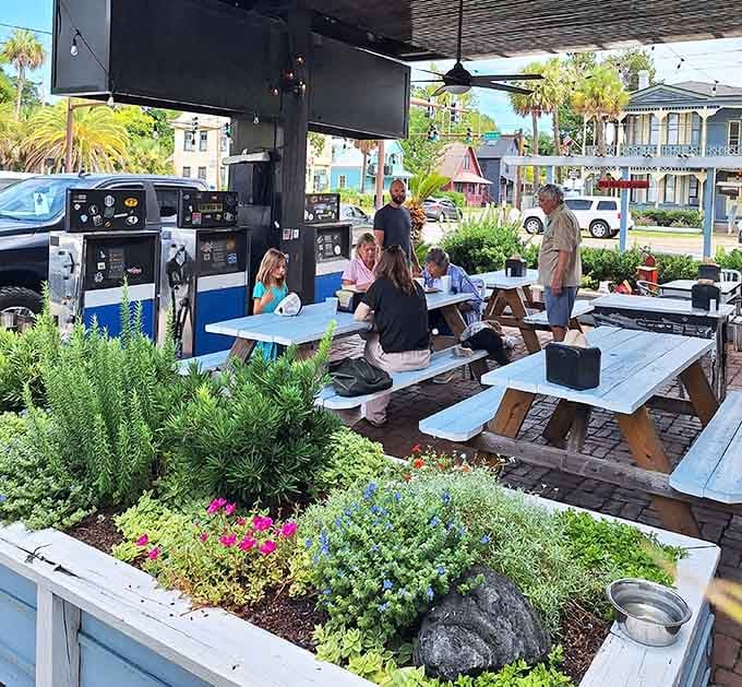 The patio seating with its garden beds and umbrellas turns a quick lunch into a mini vacation without the airport hassle.