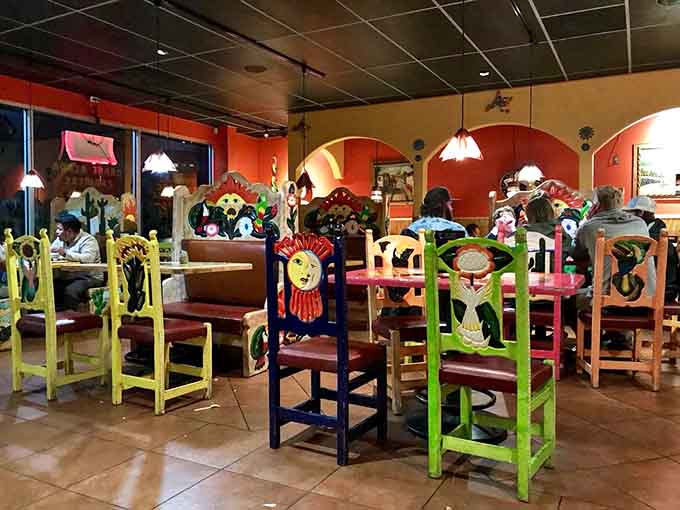 Diners enjoying their meals surrounded by artwork that's as vibrant as the flavors on their plates today.