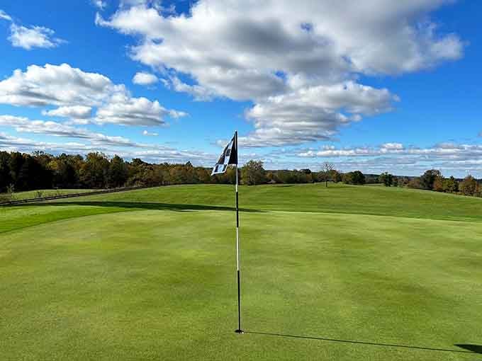 Rolling greens under dramatic skies create the perfect backdrop for a relaxing round in Kentucky's countryside.