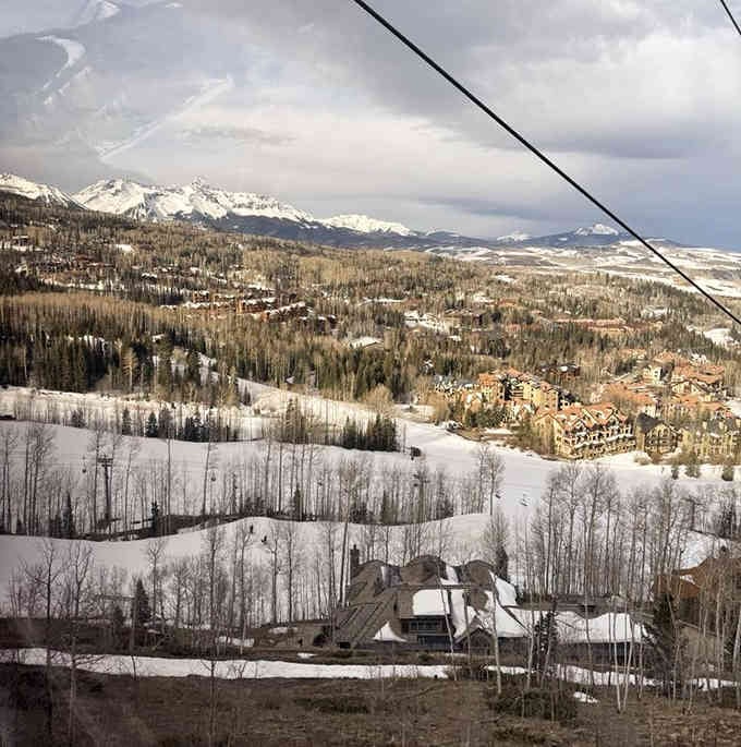 Winter transforms the gondola ride into a snow globe experience, minus the shaking and the questionable souvenir shop placement.