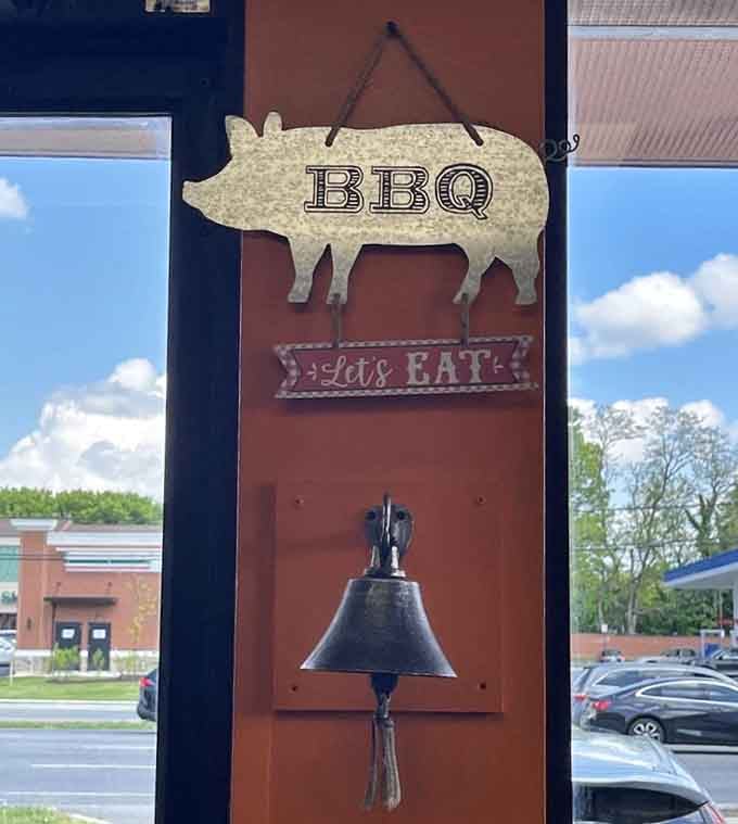 Even the pig knows what's up, hanging there with "Let's Eat" like the world's most honest dinner bell.