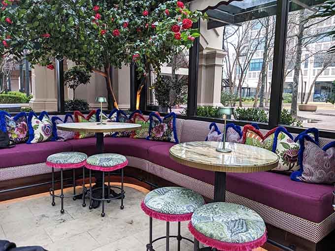 Plush seating and patterned cushions create cozy nooks perfect for lingering over coffee and conversation with friends.