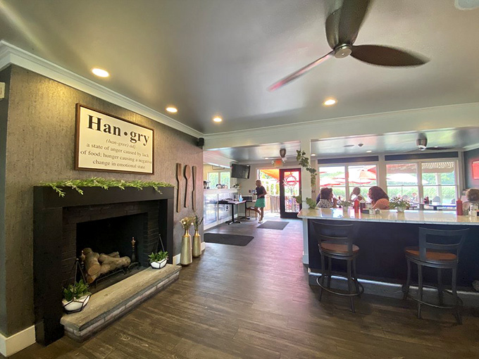 The fireplace adds warmth while the open layout keeps things bright and cheerful throughout the space.