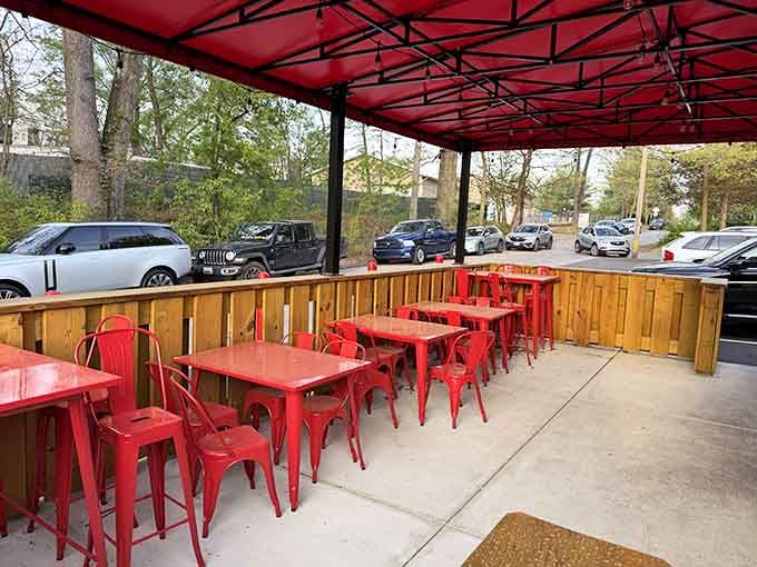 The outdoor patio with those bright red tables is perfect for warm weather barbecue sessions.