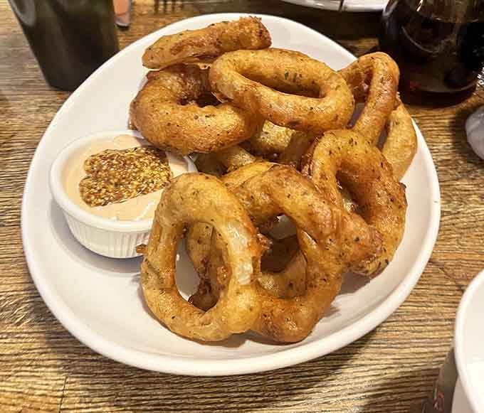 Onion rings so perfectly golden they could be in a Rembrandt painting, if he painted fried food.