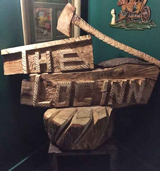 Hand-carved wooden signs showcase the craftsmanship that built this place and keeps it standing strong today.