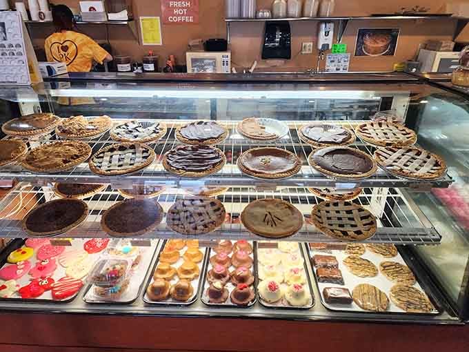 The dessert case displays whole pies and treats like edible art in a delicious museum.