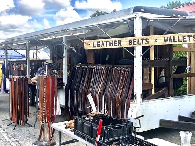 Leather belts hanging in formation, ready to hold up pants with more style than function requires.