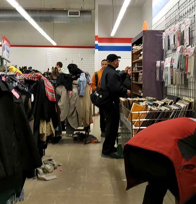Fellow treasure hunters browse with the focused intensity of people who know a good deal when they see one.