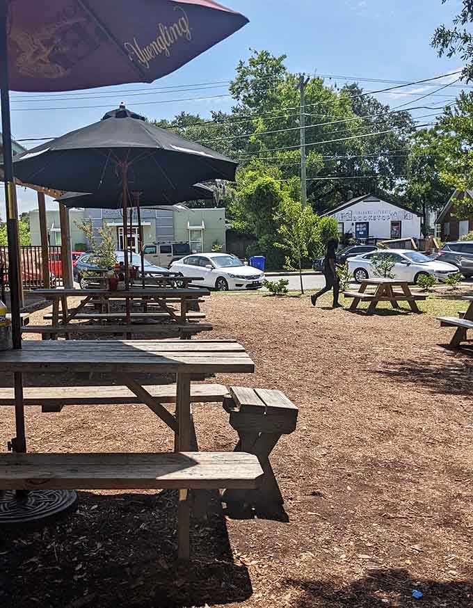 Outdoor seating under umbrellas, perfect for enjoying your oversized sandwich while soaking up that Carolina sunshine.