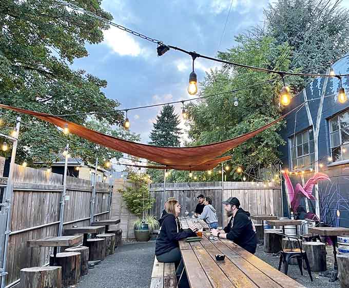 The outdoor patio transforms into a magical evening hangout spot where string lights and good company make everything taste better.