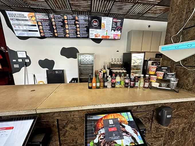 The order counter stands ready with condiments lined up like soldiers, prepared to customize your burger experience to perfection.
