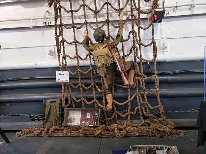 Cargo nets that carried soldiers onto hostile beaches now carry only the weight of profound historical significance.