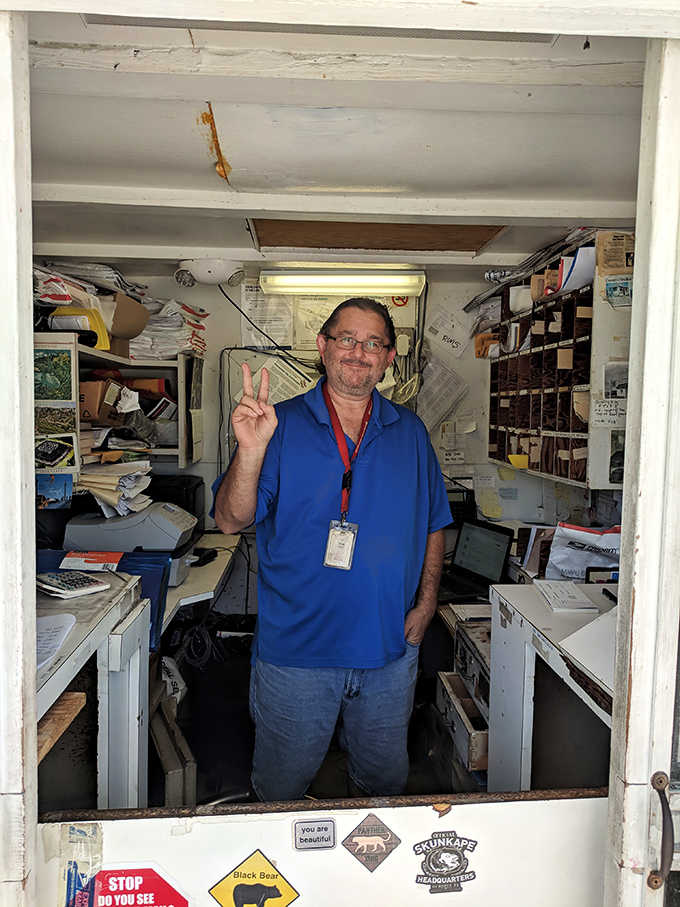 Postal workers here deserve medals for maintaining cheerful service in quarters smaller than most people's closets.