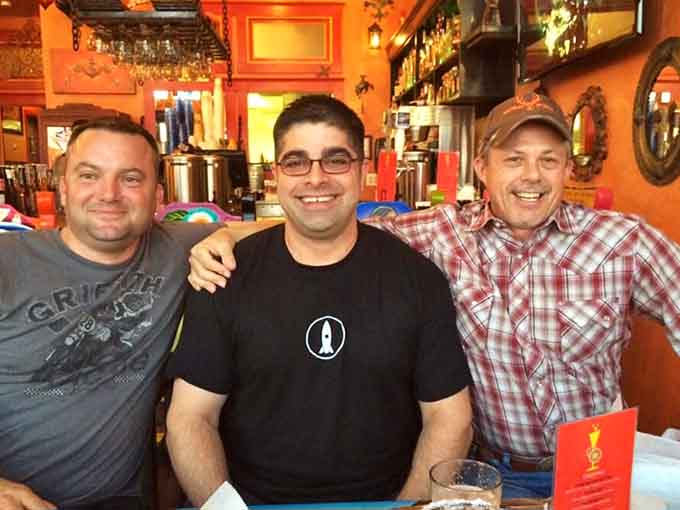 Happy diners enjoying their meals in a space that's as vibrant as the flavors on their plates.