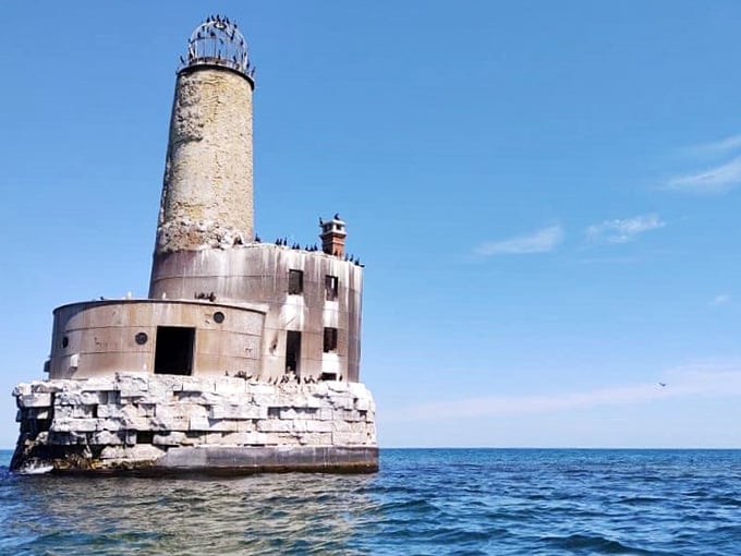 On sunny days, the lighthouse looks almost peaceful, slowly melting into the lake that surrounds it like a patient sculptor.