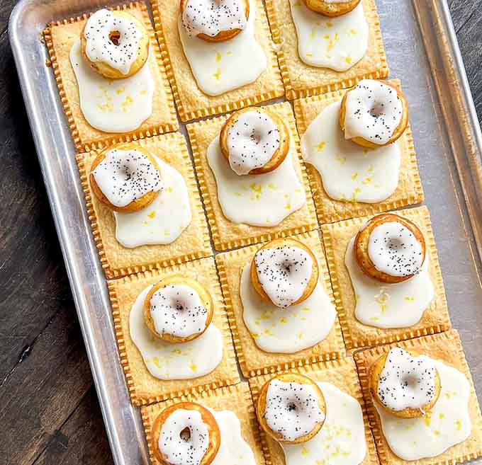 Lemon poppy seed Weeshtarts topped with tiny donut decorations showcase the playful creativity that makes Weesh a destination worth seeking out in Roslindale.