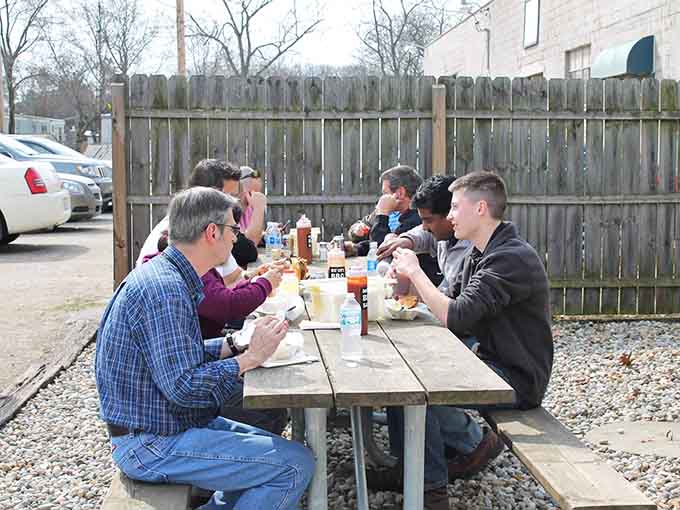 Outdoor dining where the conversation flows as freely as the barbecue sauce on a perfect spring afternoon.