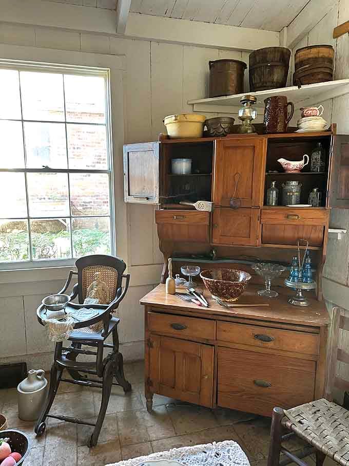 Antique cabinets holding household essentials from an era when your biggest worry wasn't ghosts but keeping the wood stove lit.